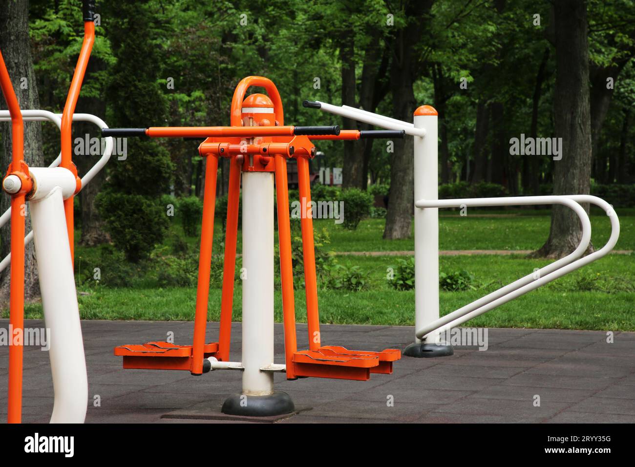 Empty outdoor gym with double abductor and push up bars Stock Photo - Alamy