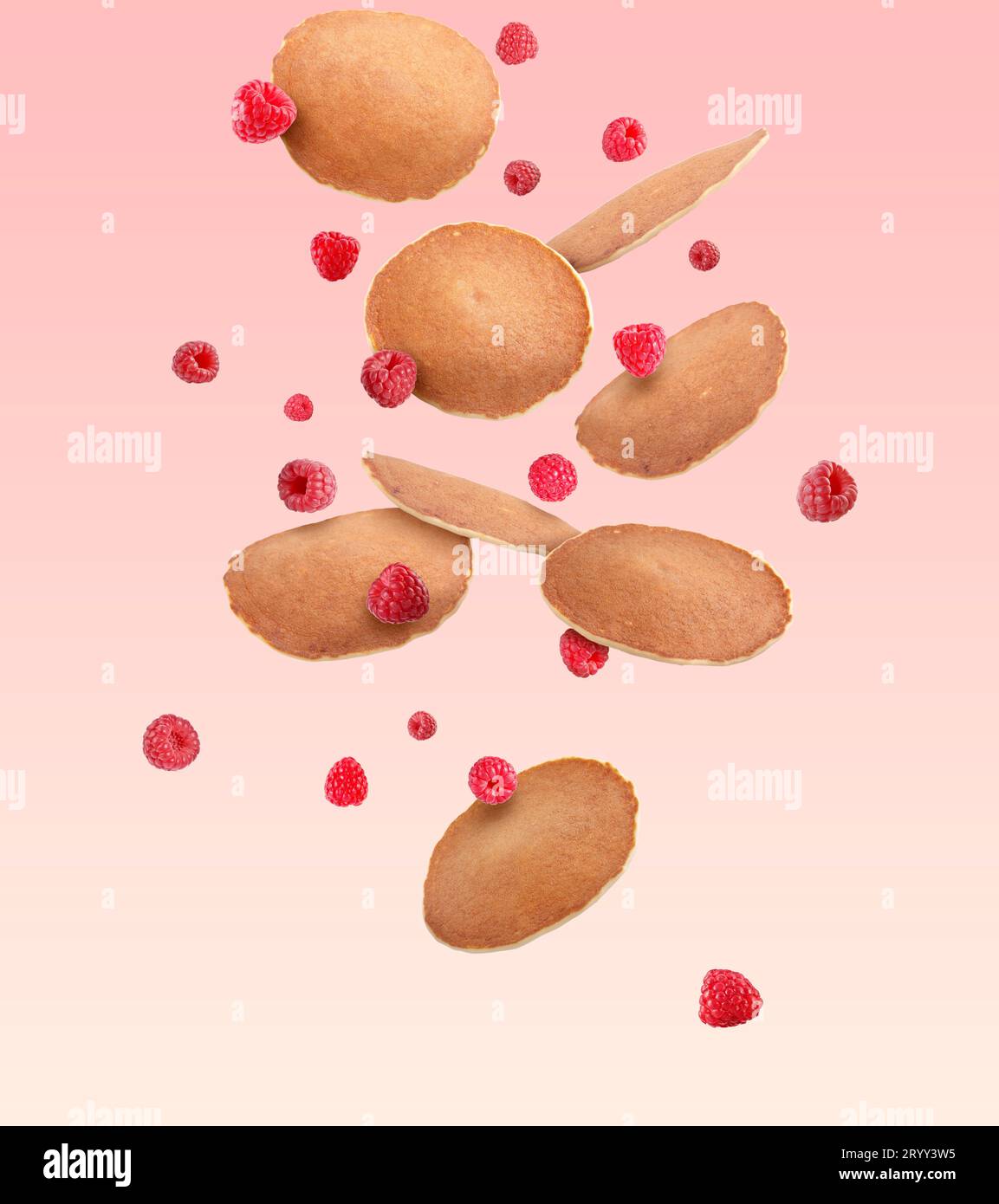 Many fresh pancakes and raspberries flying on pale red background Stock ...