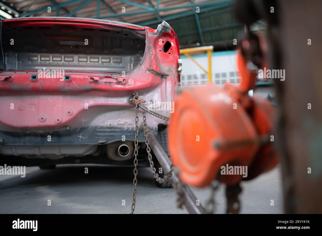 The car crashed so hard that the car body collapsed into distortion. A ...