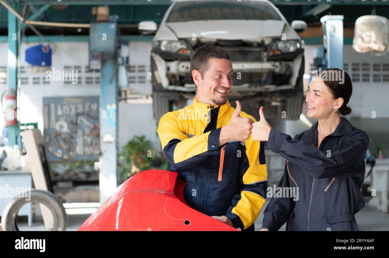 Portrait of engineer and auto mechanic with working on engine repairs in car garages Stock Photo ...