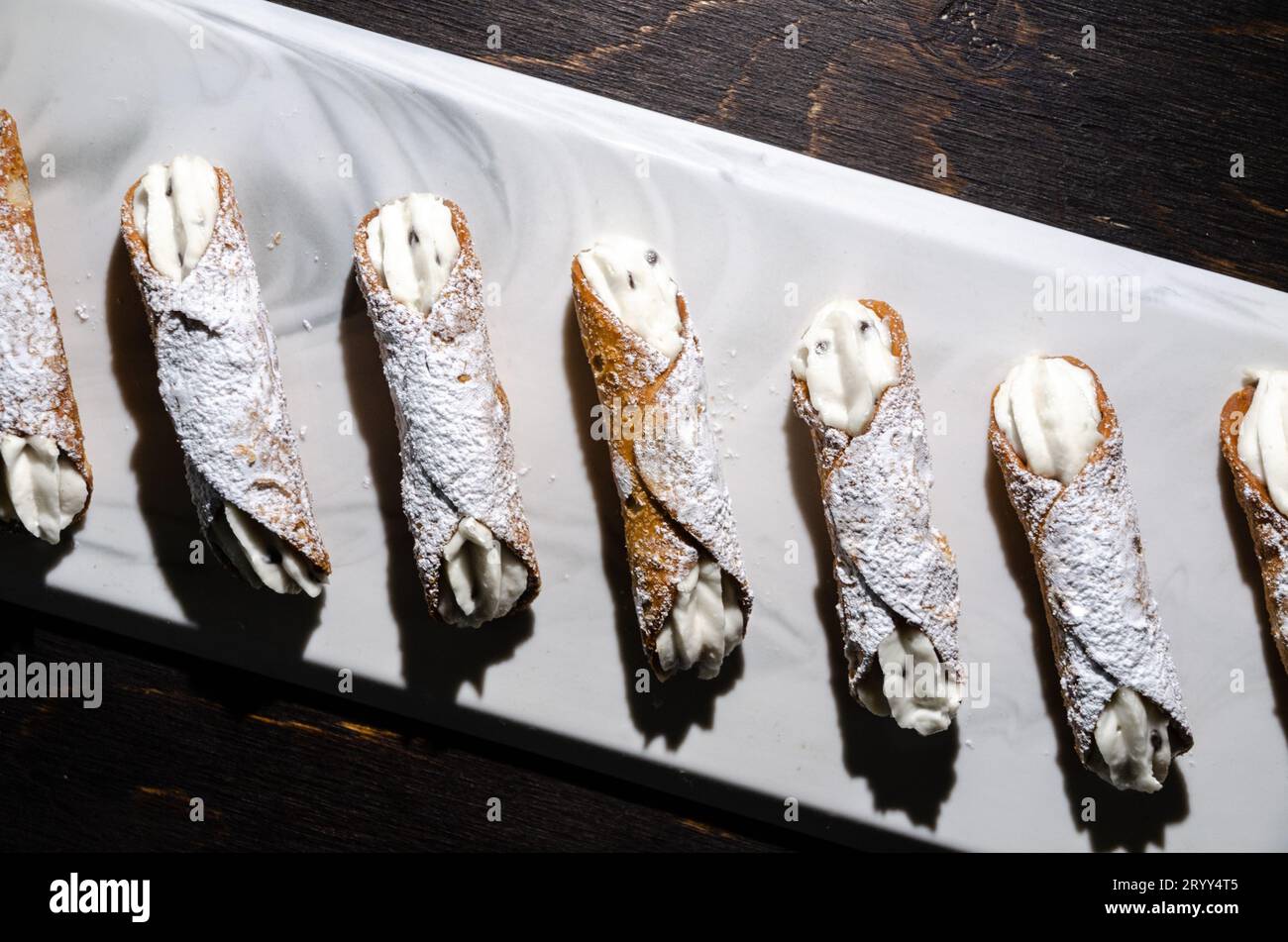 Photo of cannoli, Italian desserts originally from Sicily. Has a hard ...