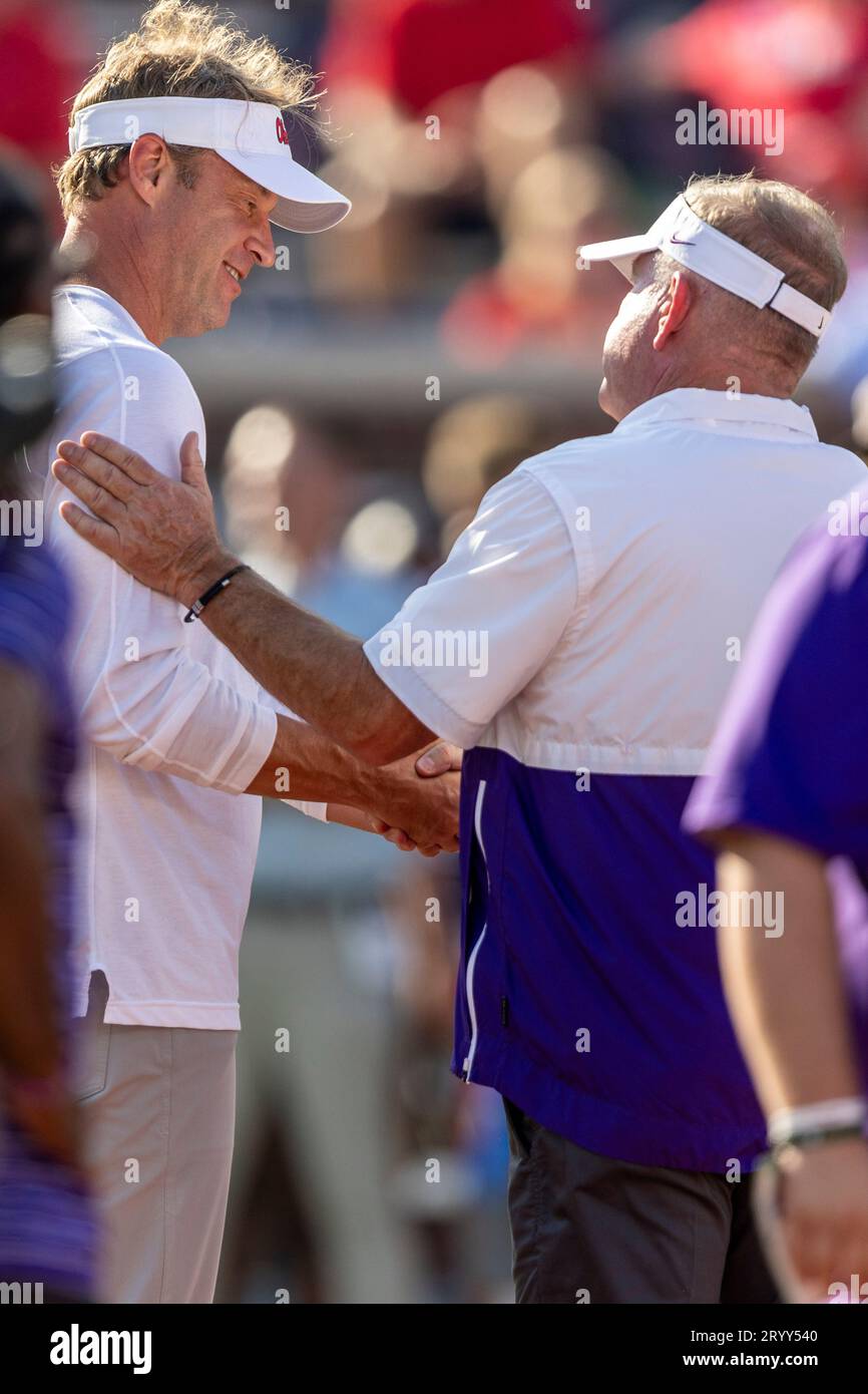 Mississippi head coach Lane Kiffin, left, talks with LSU head coach ...