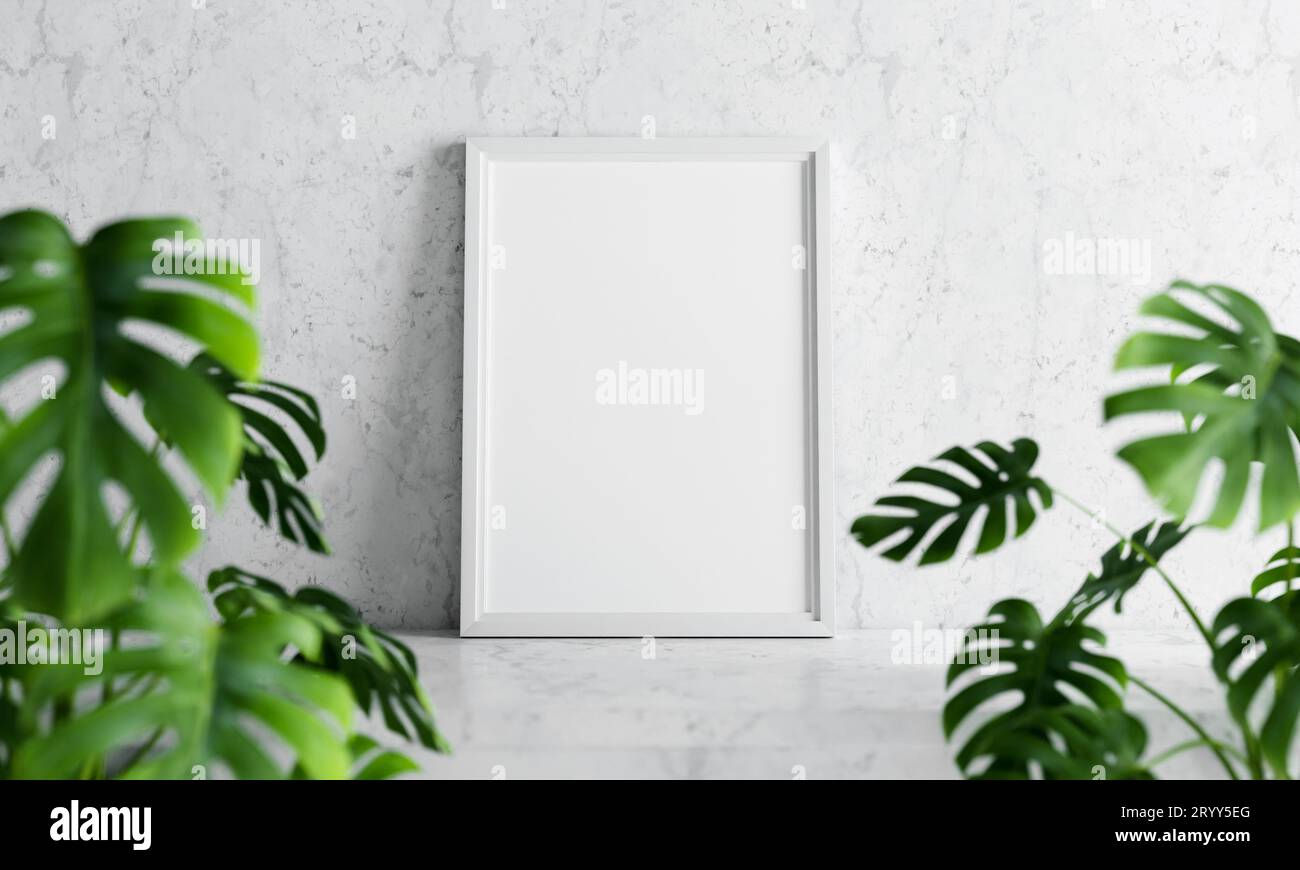 Empty photo frame mockup on white marble table with swiss cheese plant ...