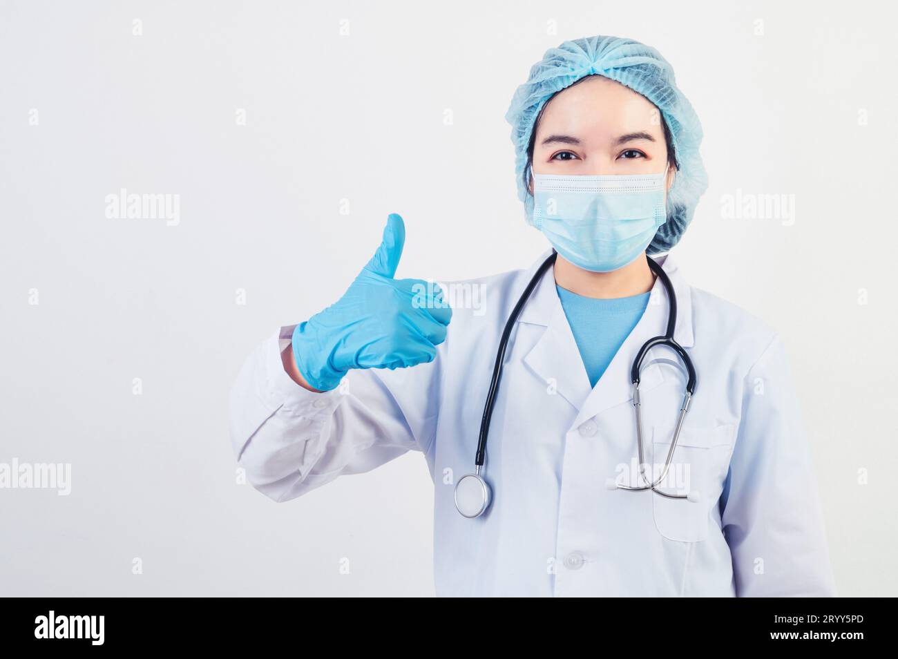 Professional doctors give big thumbs up gesture on white background to ...