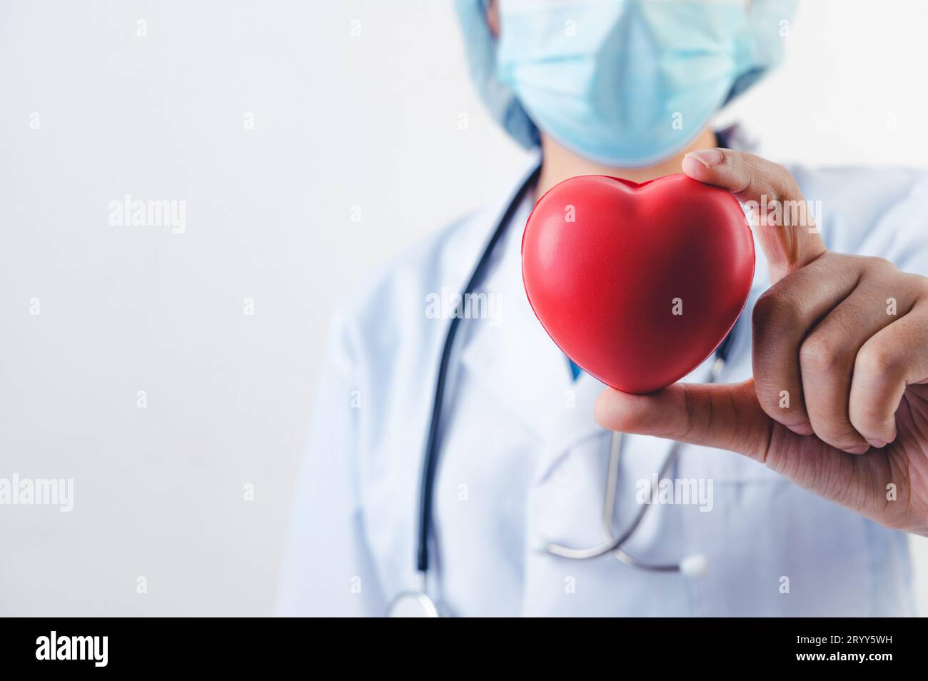 Closeup of red heart in doctor hand with stethoscope on white ...