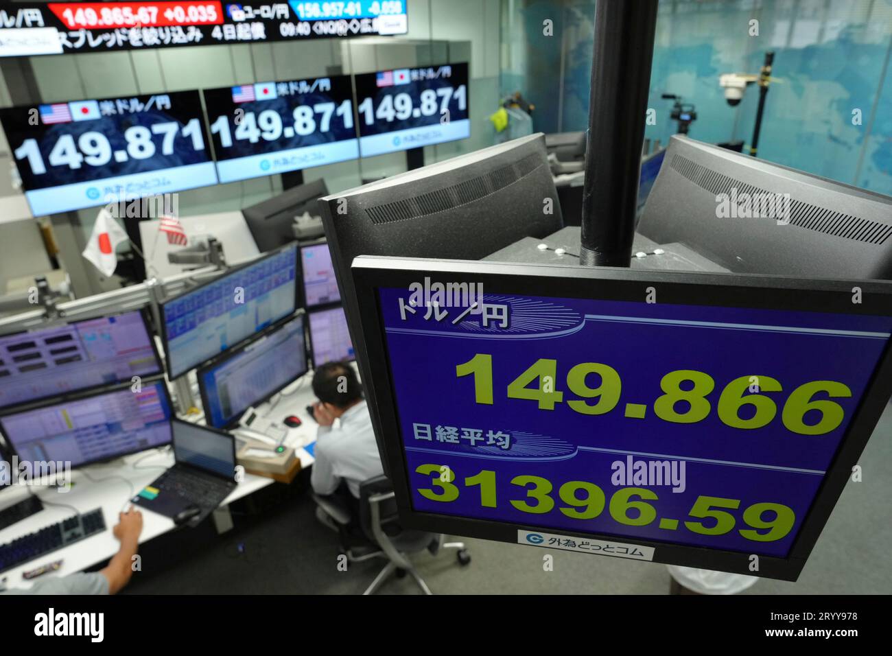 A monitor shows the exchange rate of the Japanese yen against the U.S ...