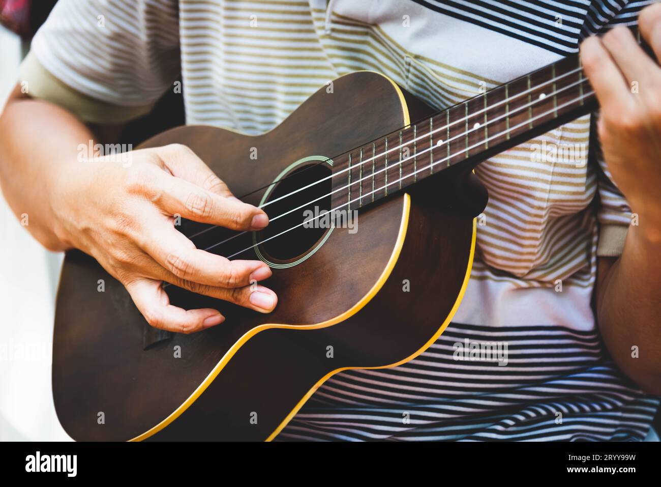 Closeup of guitarist hand playing guitar. Musical instrument concept ...