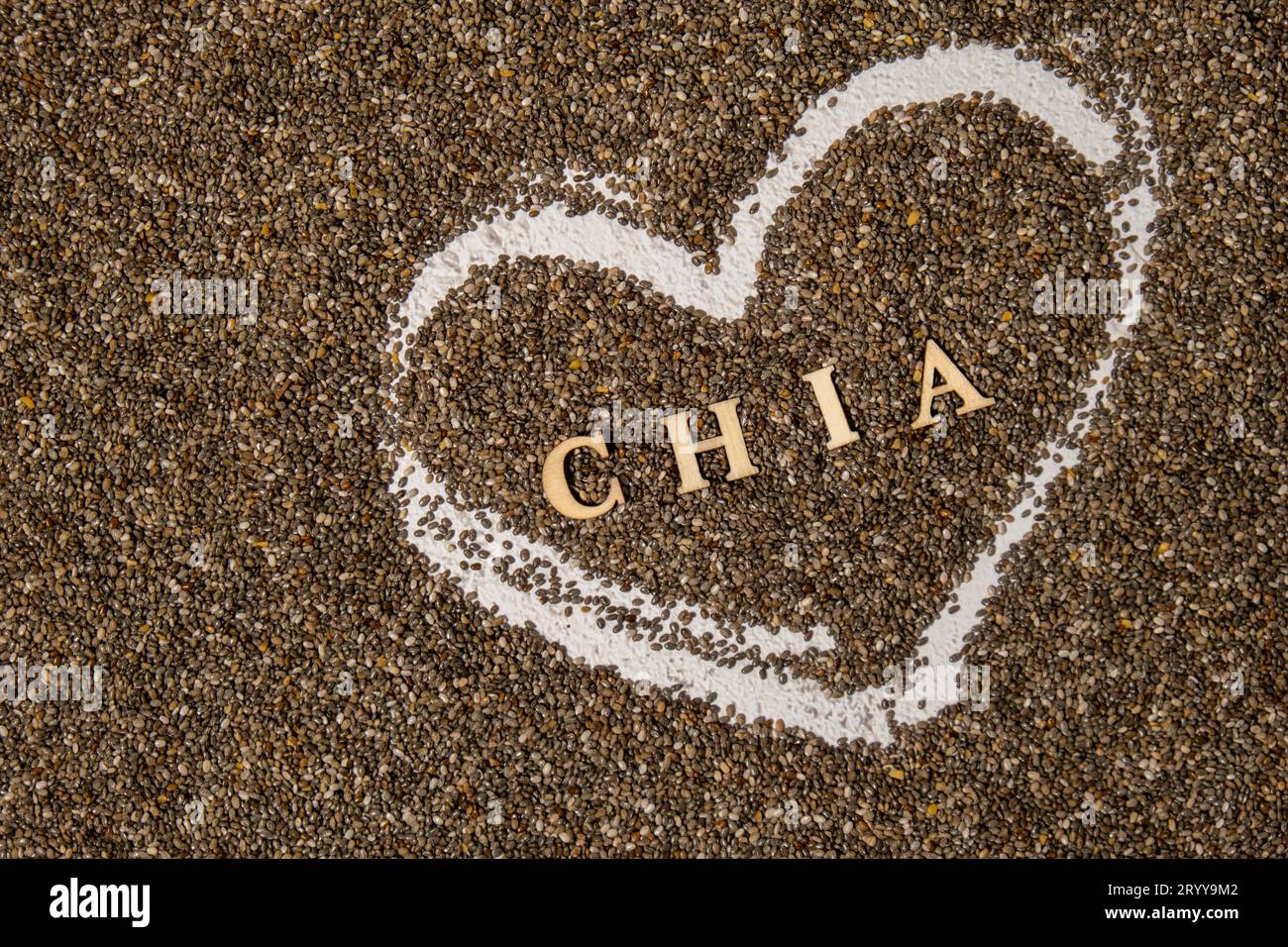 Heart made of chia seeds with word CHIA inside background. Healthy ...