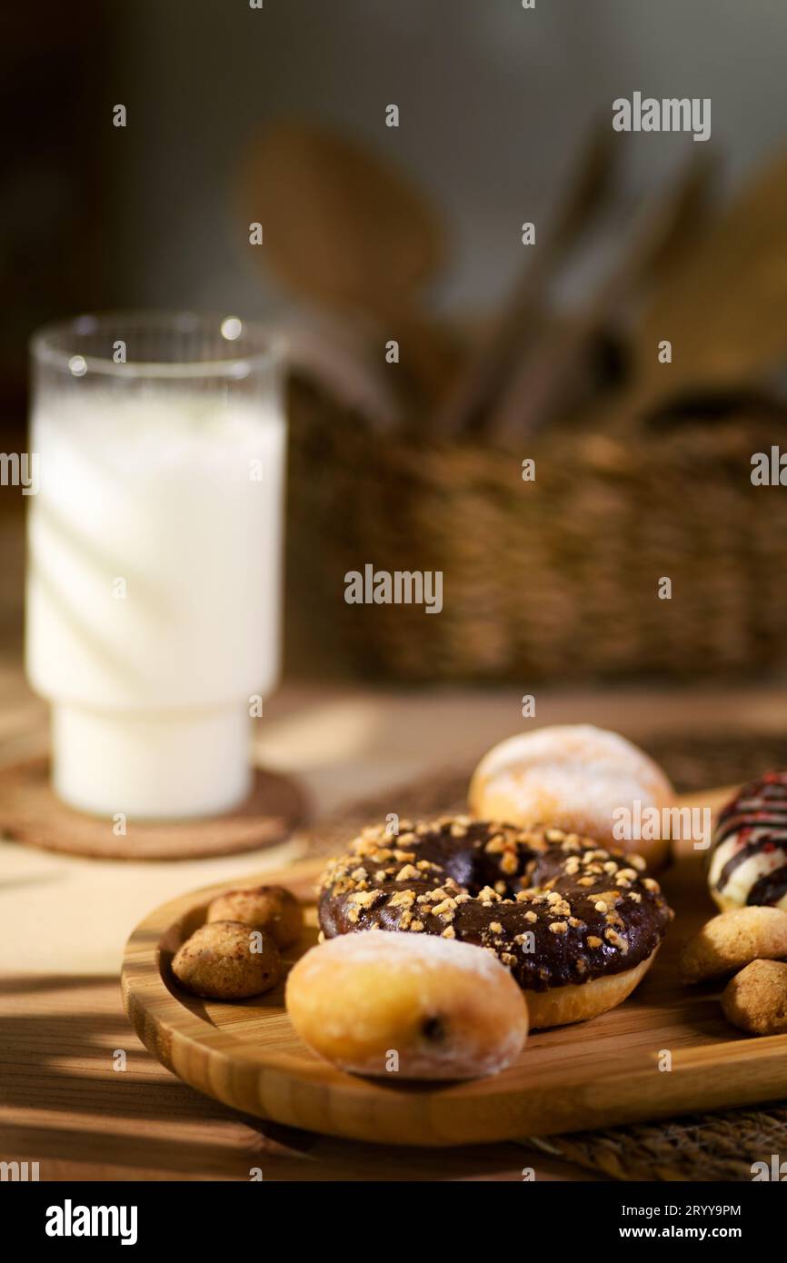 A Rustic Wooden Tray Showcases Three Donuts Chocolate Filled Cookies