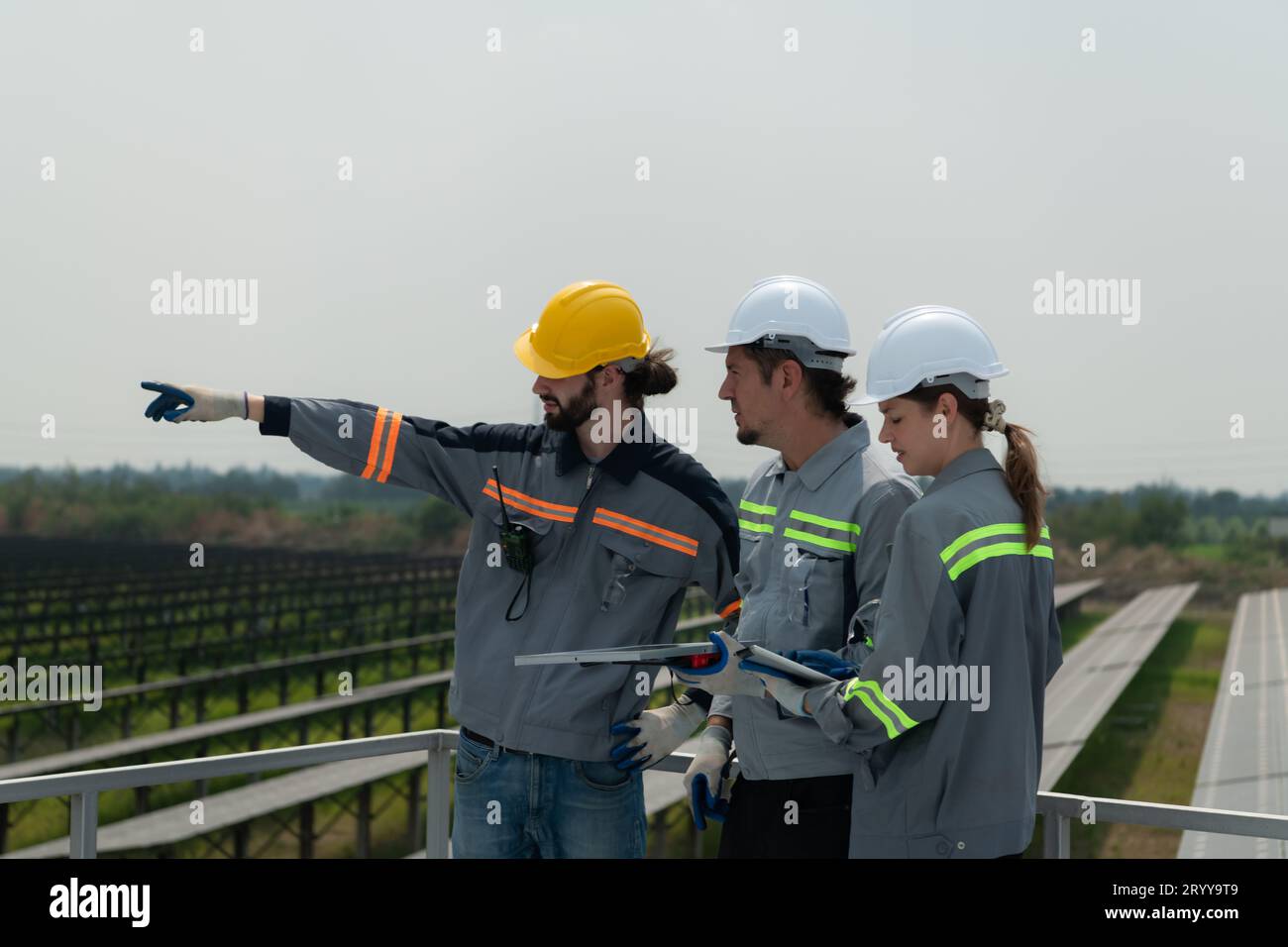 On the rooftop of a large solar energy storage station building A team ...
