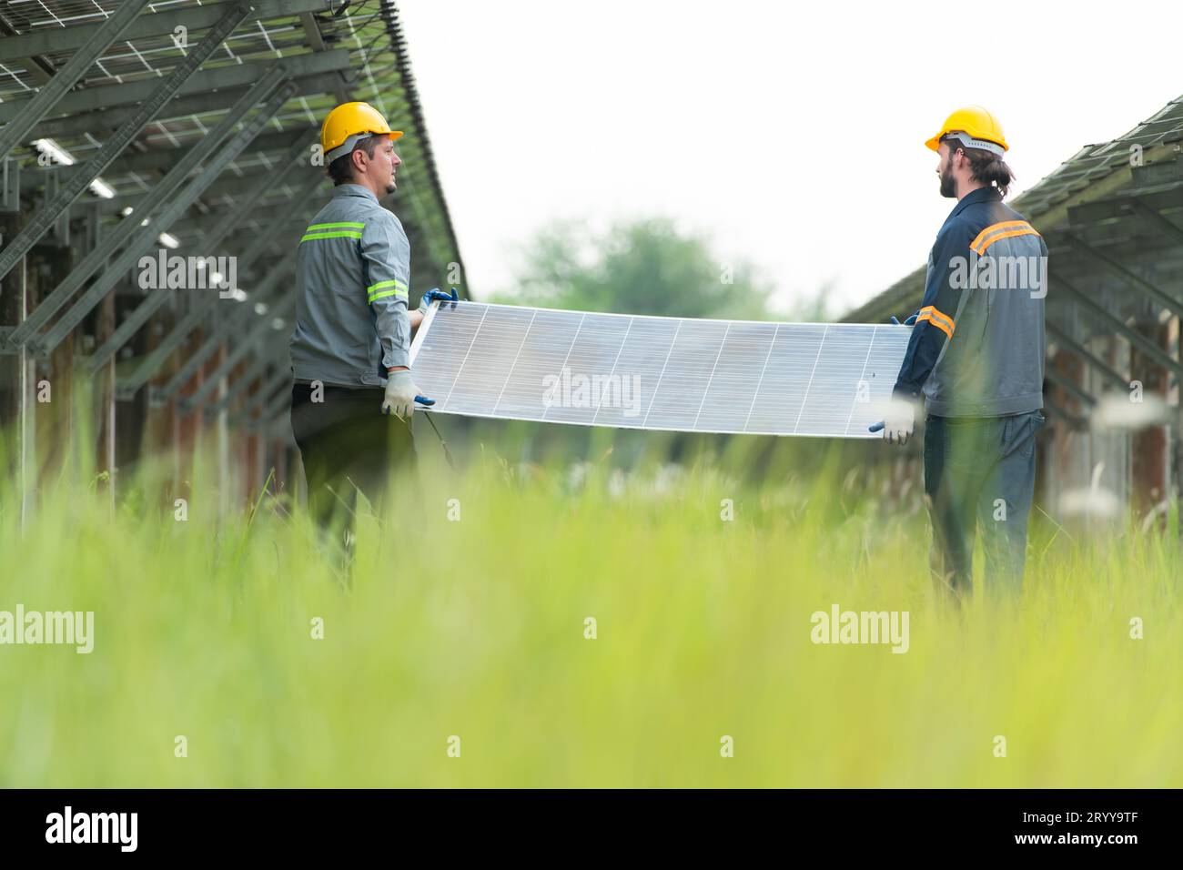 Engineering and technician unloading repaired solar panels to be ...