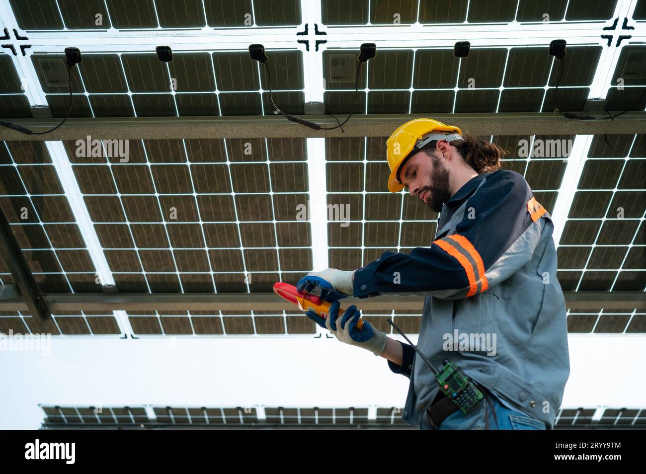 Electrical engineers are inspecting and maintaining solar cells at a ...