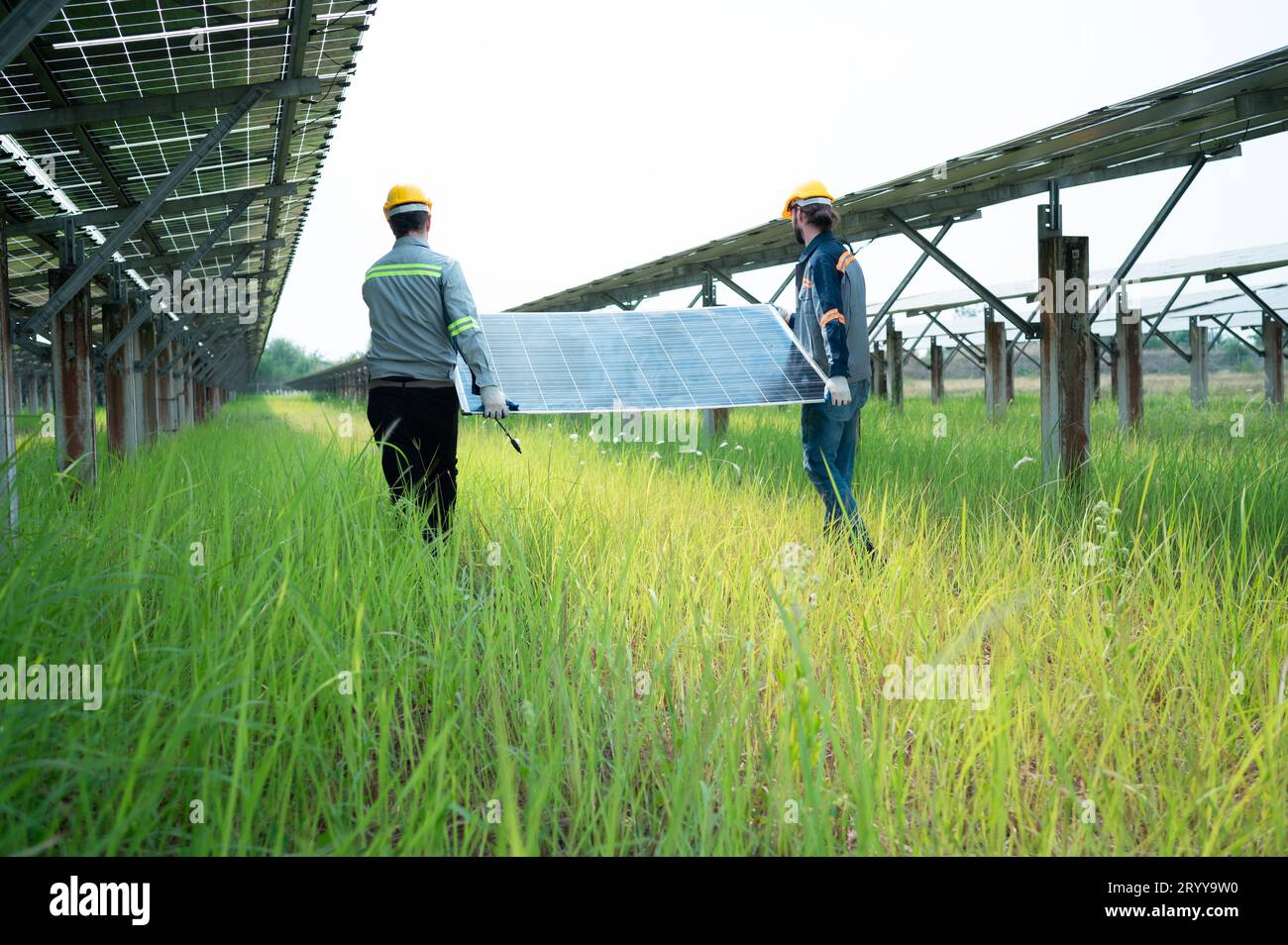Engineering and technician unloading repaired solar panels to be ...