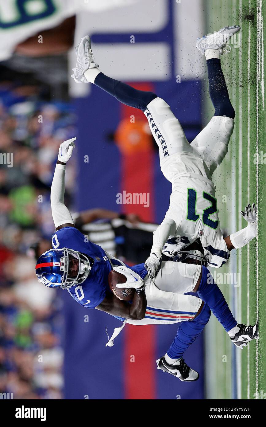 New York Giants wide receiver Parris Campbell (0) avoids a tackle by ...