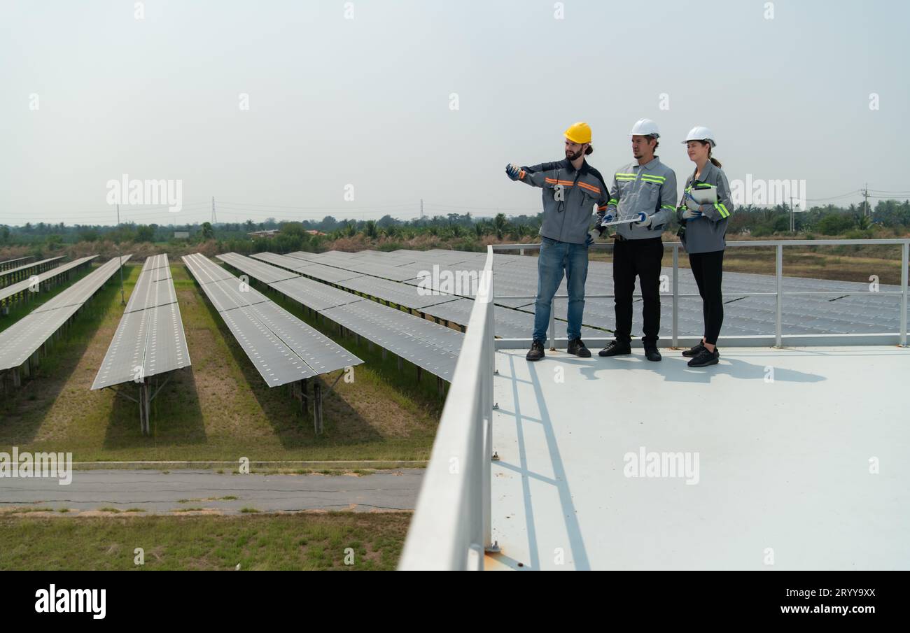 On the rooftop of a large solar energy storage station building A team ...