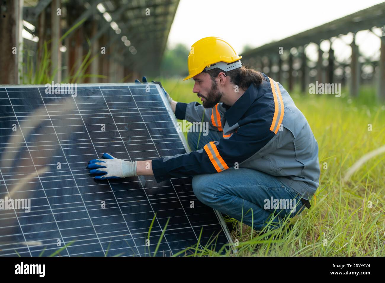 An electrical engineer is inspecting a solar cell that has been used ...