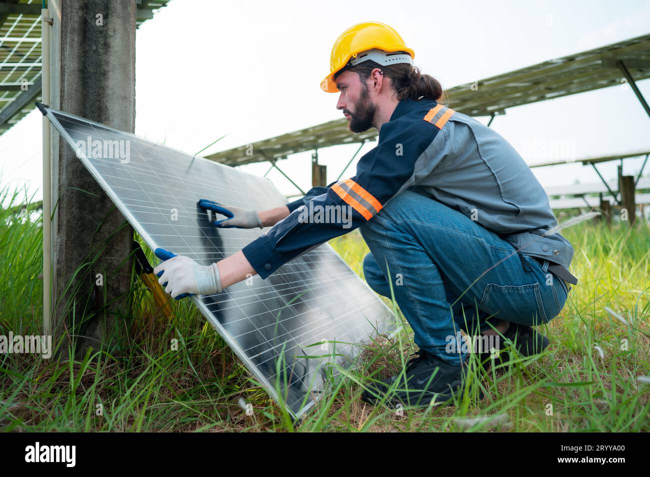 An electrical engineer is inspecting a solar cell that has been used ...