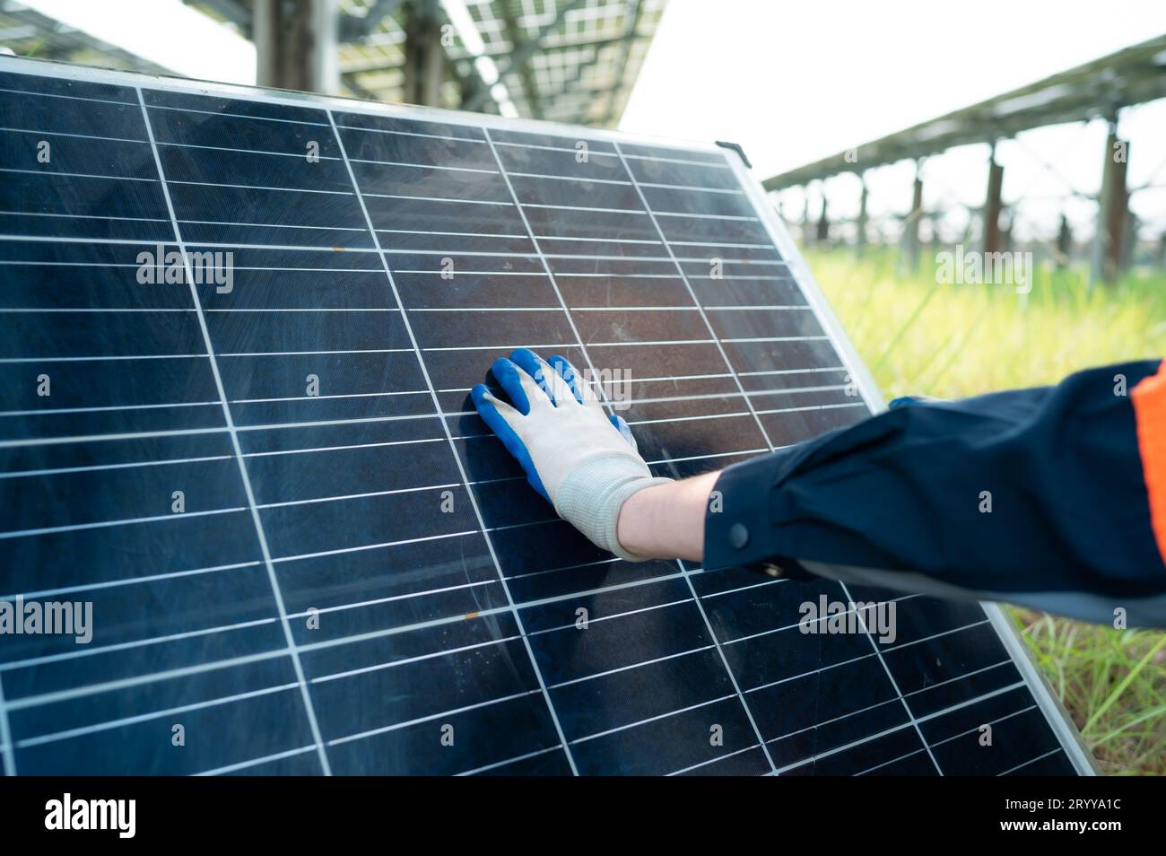 An electrical engineer is inspecting a solar cell that has been used ...