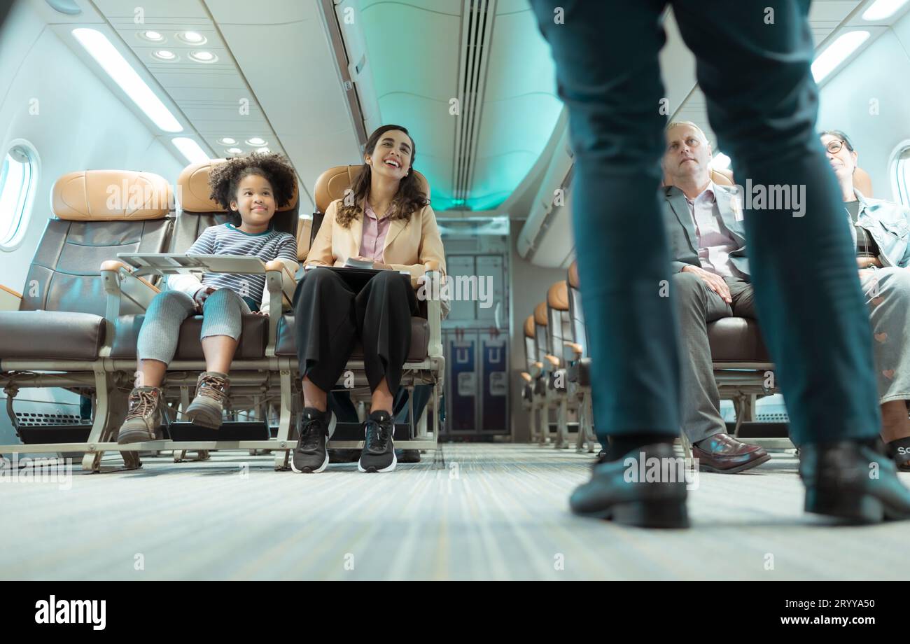 Flight attendants show how to use safety devices and recommend ...