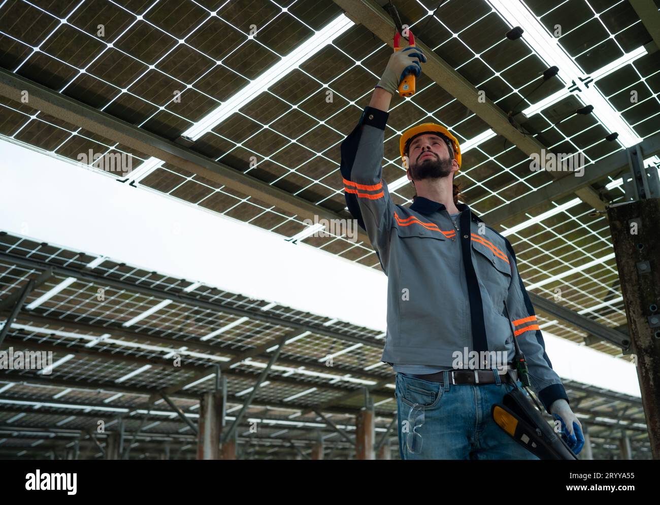 Electrical engineers are inspecting and maintaining solar cells at a ...
