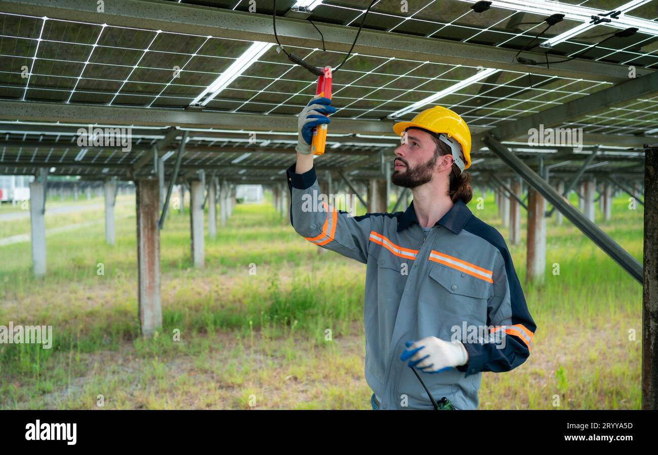 Electrical engineers are inspecting and maintaining solar cells at a ...