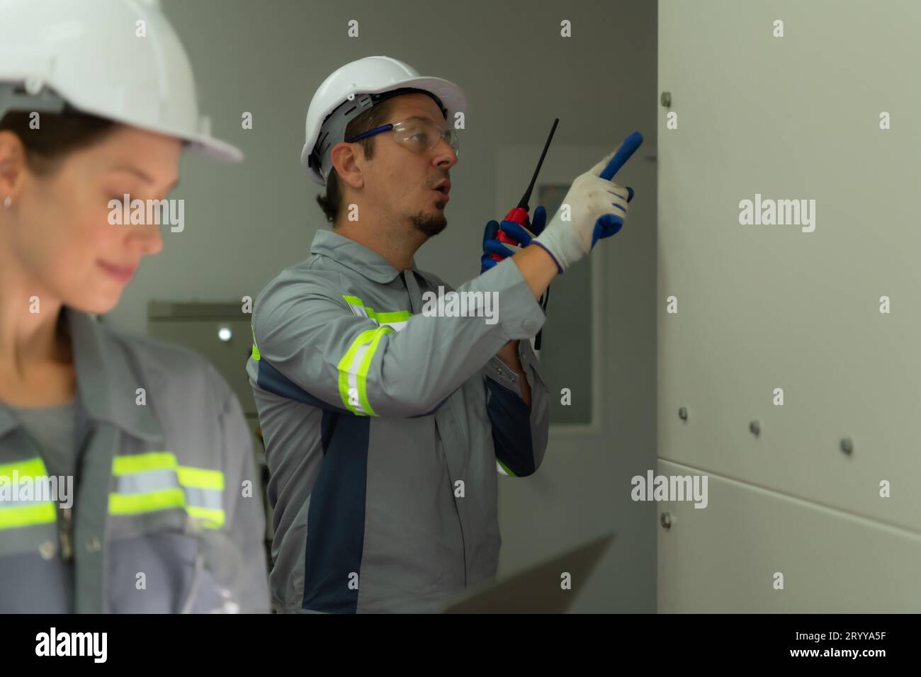 Electric power engineering team inspecting system of a large solar ...