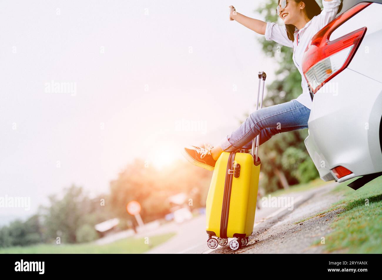 Happy Asian woman spread arms widely and breathed fresh air with ...