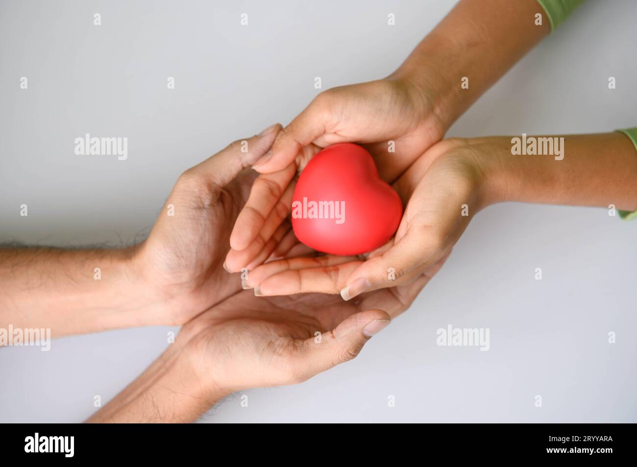 Closeup of Helping hand of heart donor for patient in heart disease ...