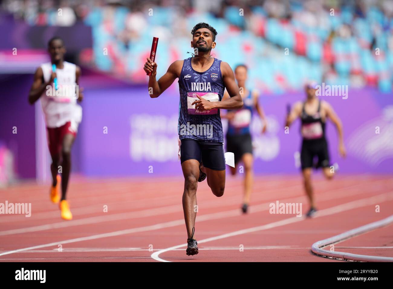 India's Mijo Chacko Kurian crosses the finish line during the men's ...
