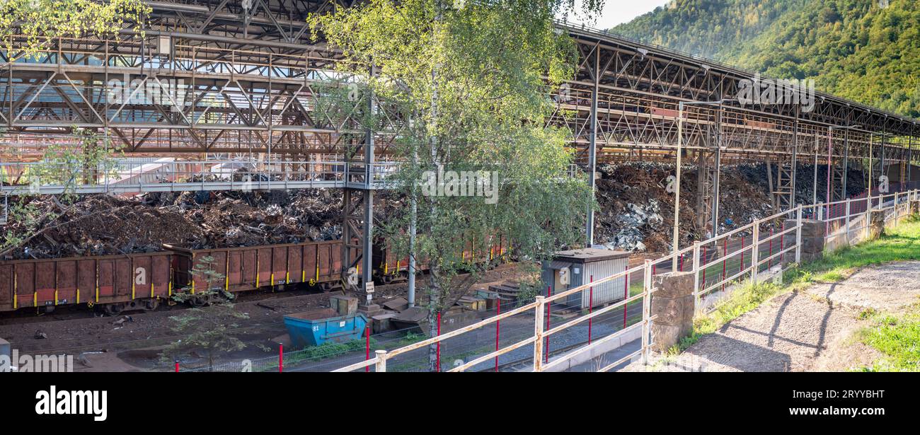 Piles of scrap metal. Scrap metal heap. Discarded material sorted and ...