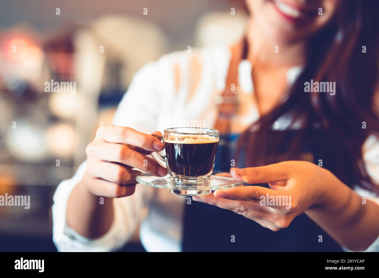 Closeup of coffee cup with beautiful Asian woman barista background for ...