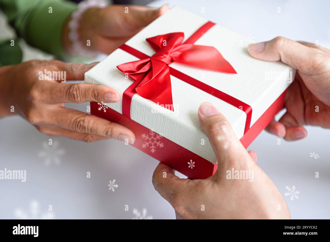 Closeup of hands giving gift box in Christmas day and new year festival ...