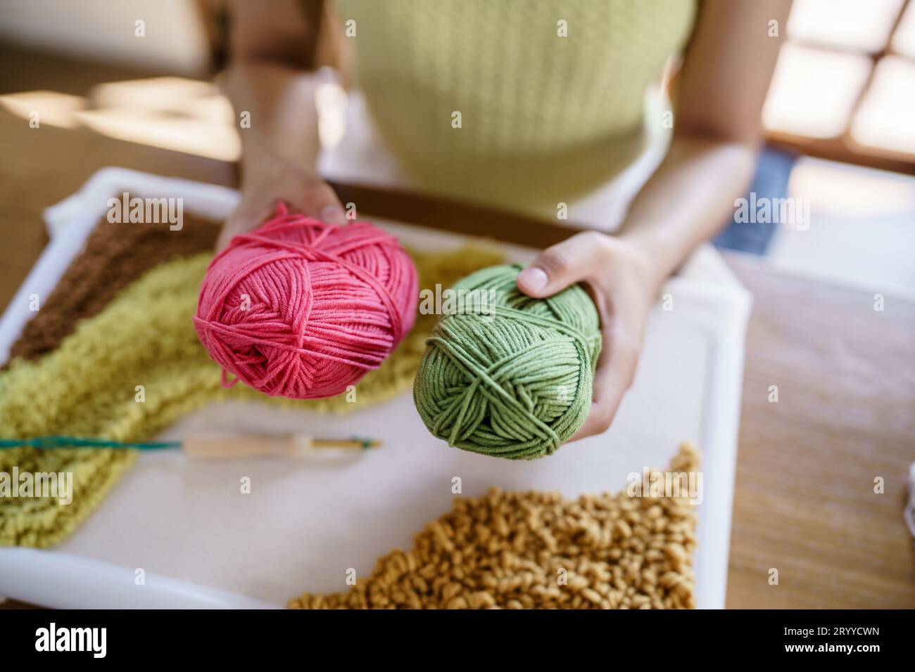 Punch needle. Asian Woman making handmade Hobby knitting in studio ...
