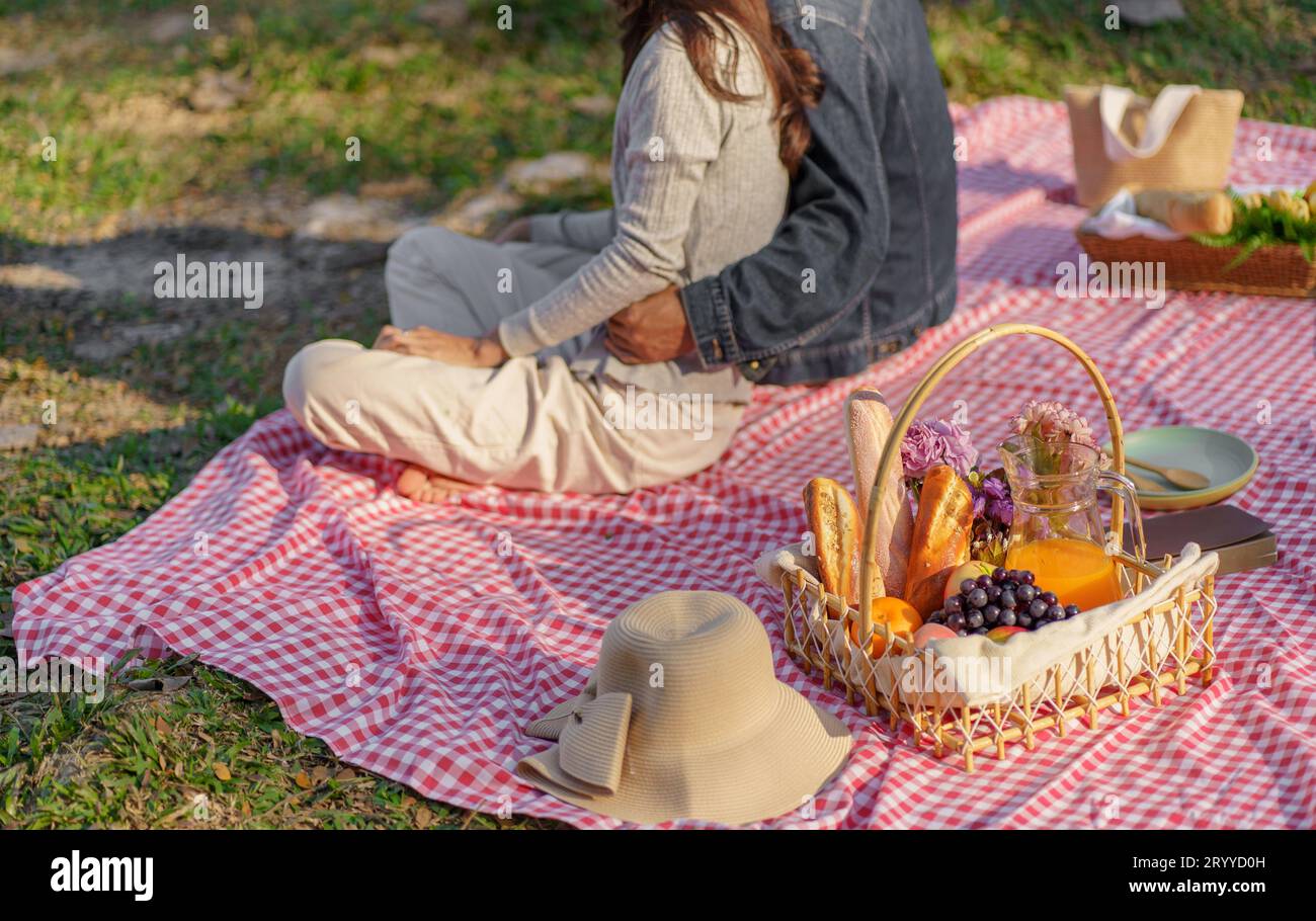 In love couple enjoying picnic time in park outdoors Picnic. happy ...