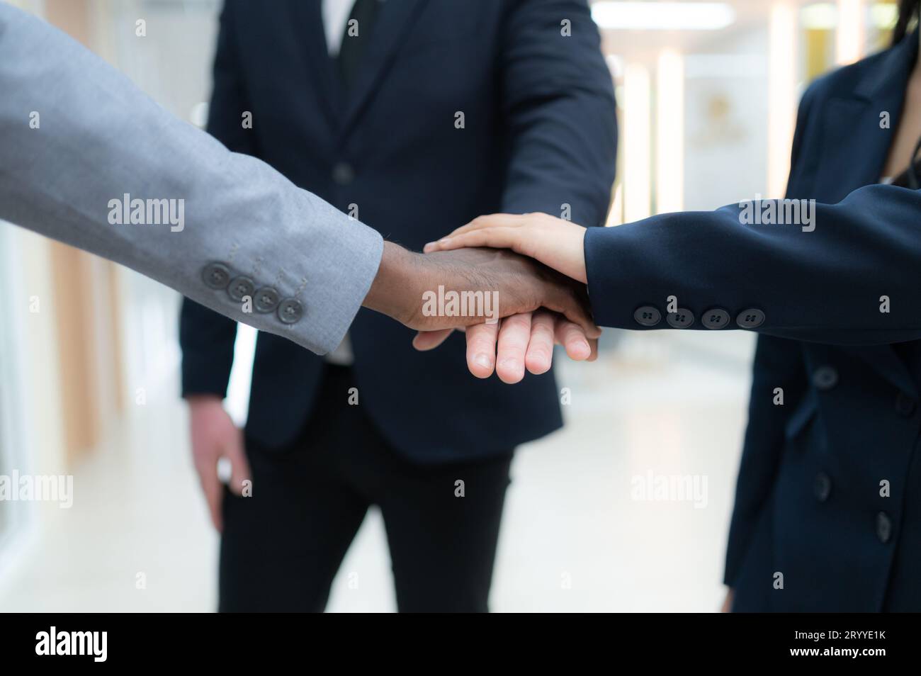 Unity joining hands hi-res stock photography and images - Alamy
