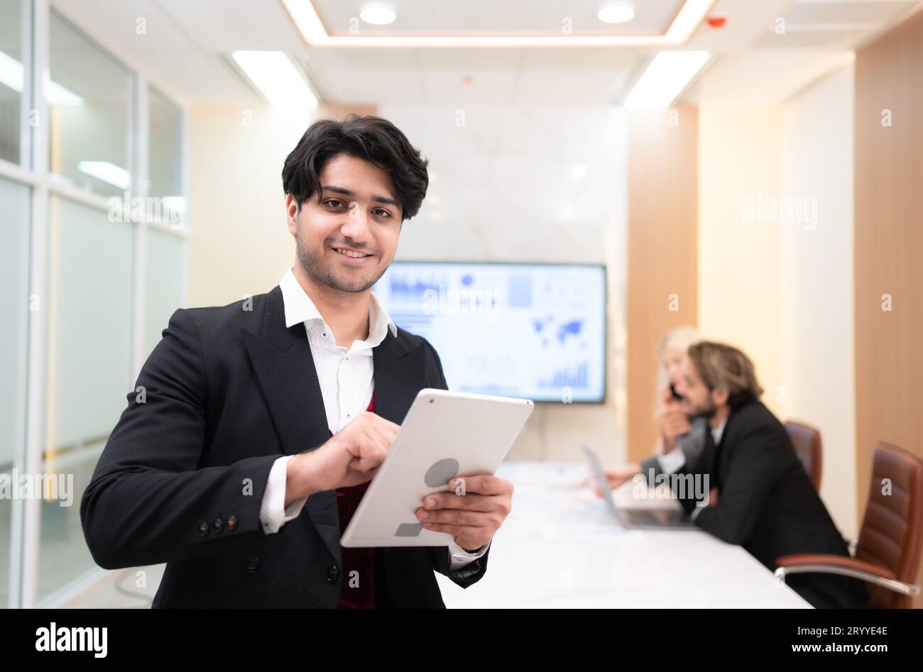 At the meeting room, a young businessman sitting in a secret meeting ...