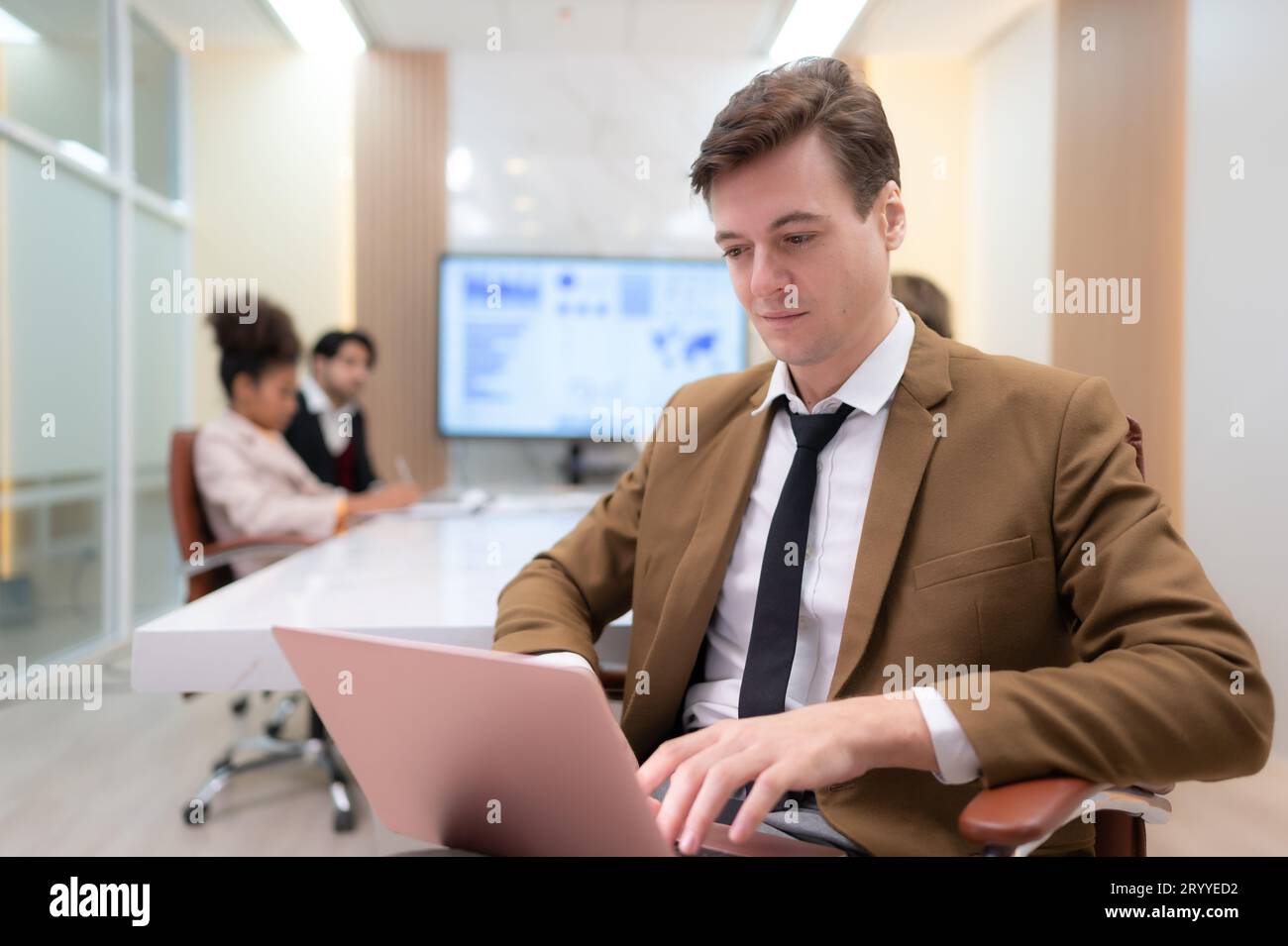 At the meeting room, a young businessman sitting in a secret meeting ...