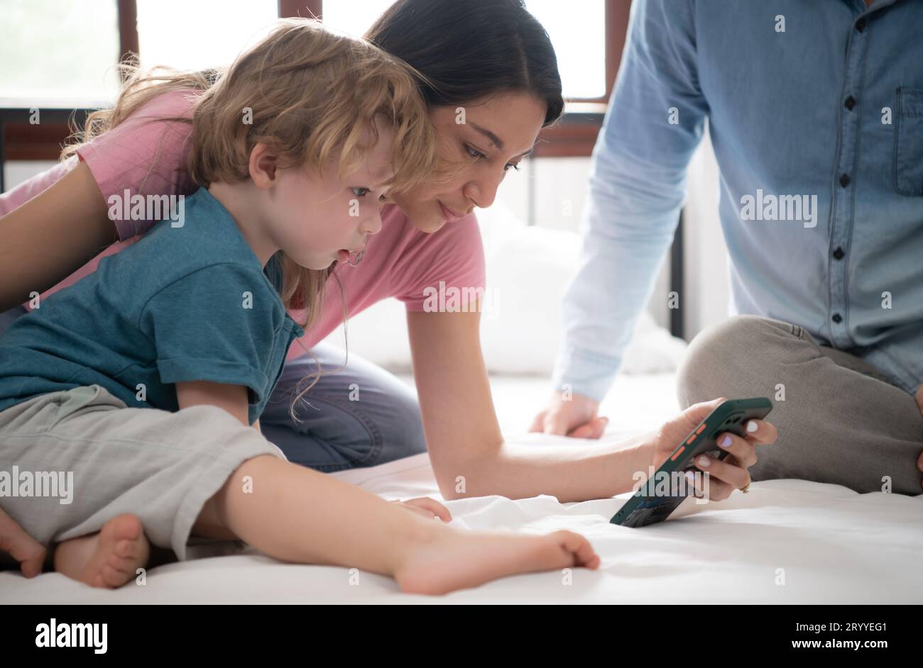 After the little boy wakes up from his nap, his father and mother ...