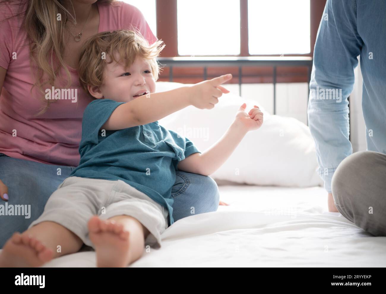After the little boy wakes up from his nap, his father and mother ...