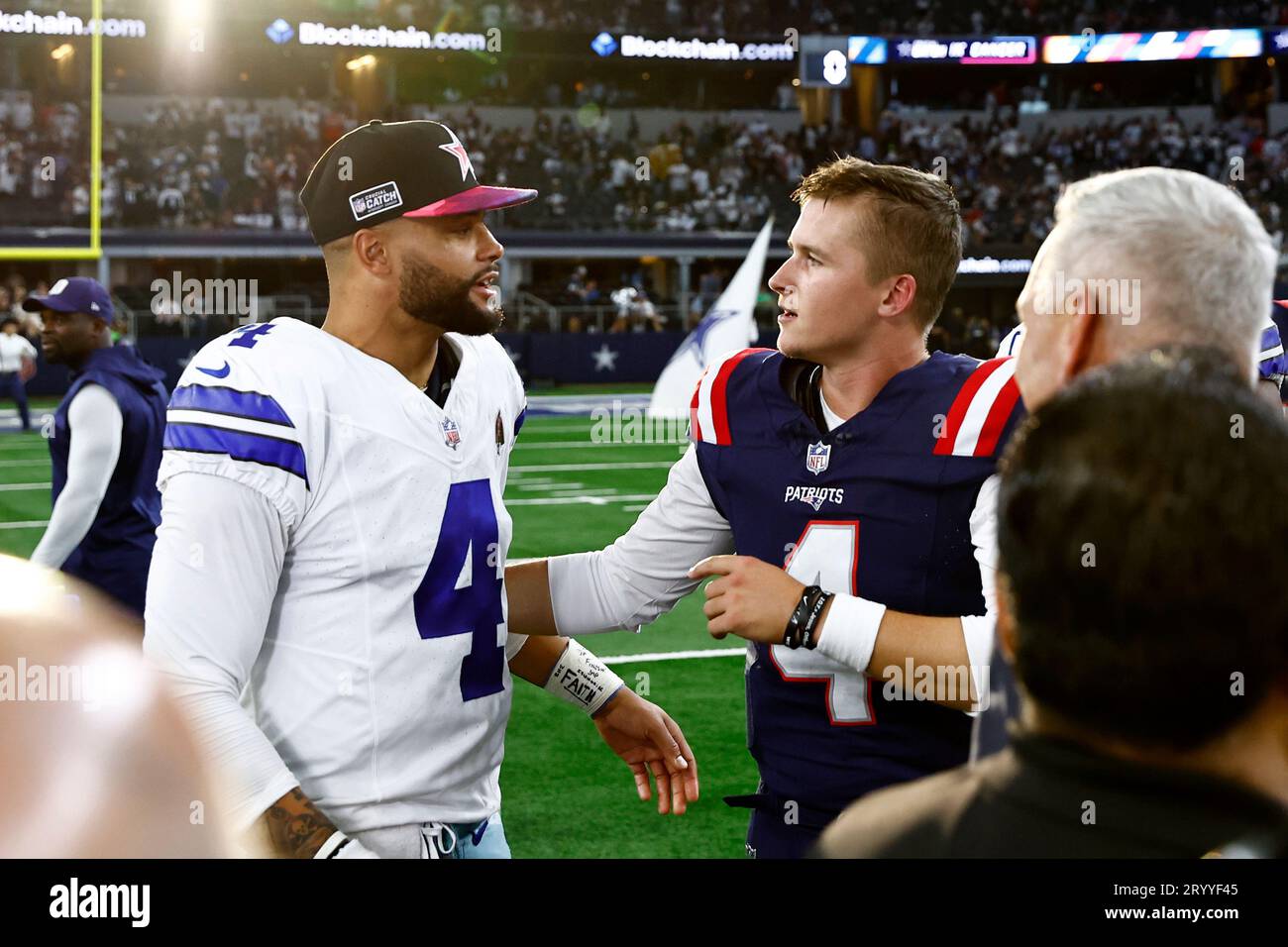Dallas Cowboys quarterback Dak Prescott, left, greets New England ...