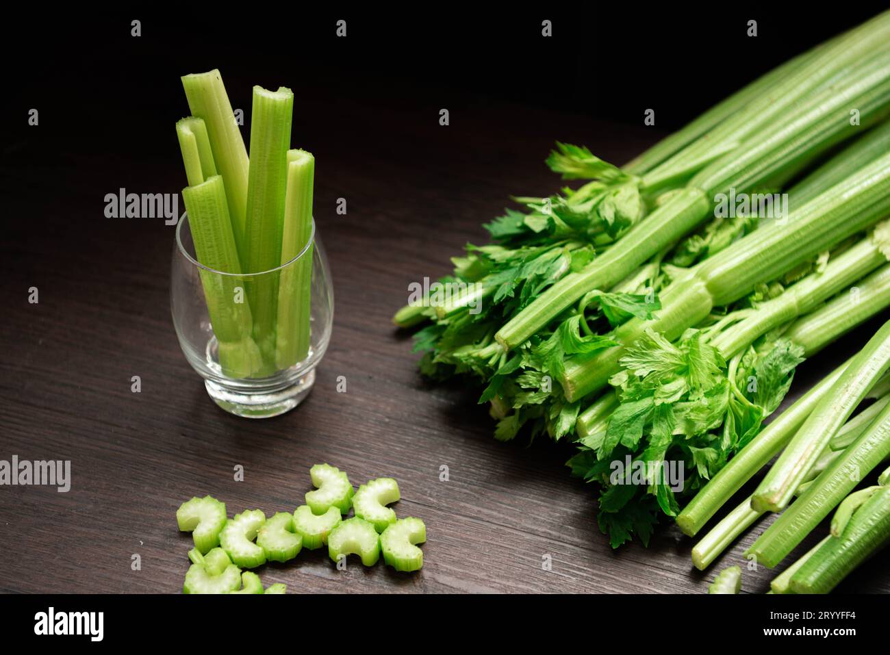 Bunch of fresh celery stalk on wooden table with leaves prepared for ...