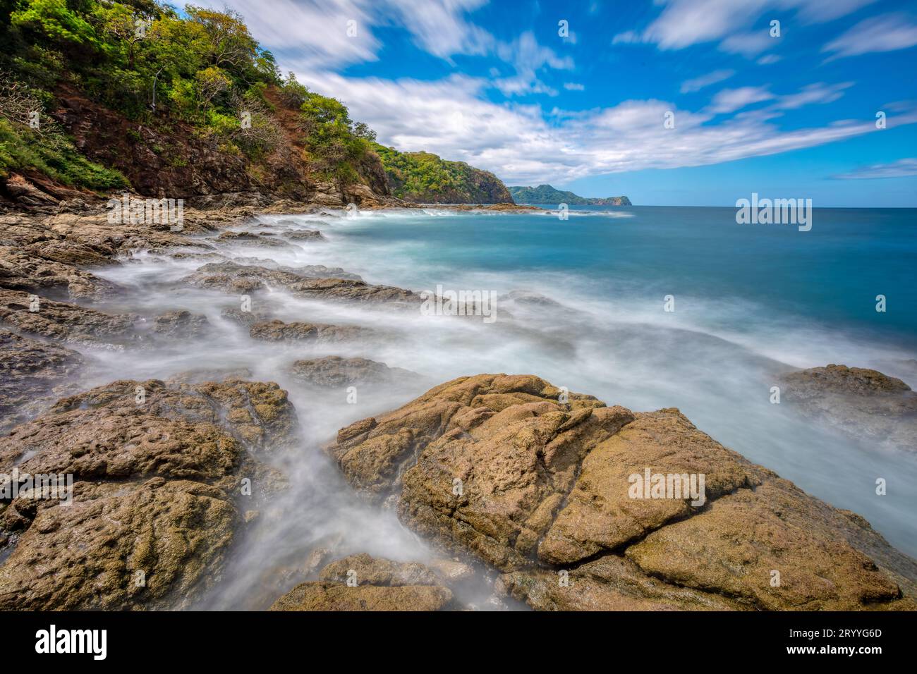 Long exposure, pacific ocean waves on rock in Playa Ocotal, El Coco ...