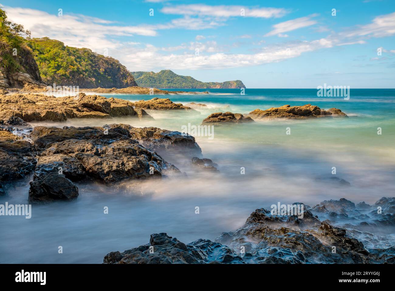Long exposure, pacific ocean waves on rock in Playa Ocotal, El Coco ...