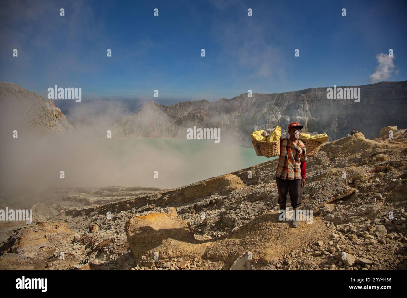 Sulphur mine worker on Ijen volcano crater, East Java, Indonesia Stock ...