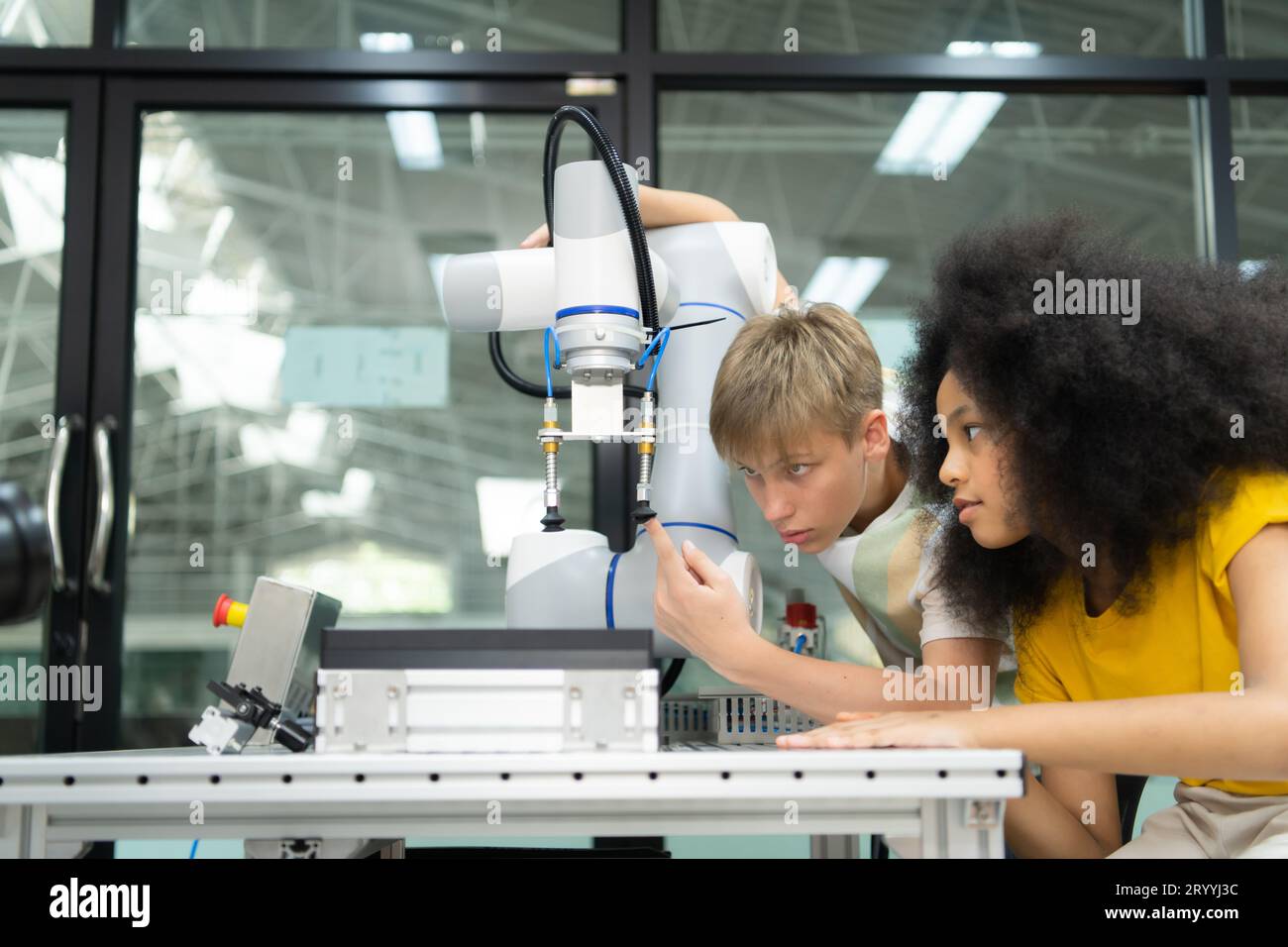Children using the hand robot technology, Students are studying ...