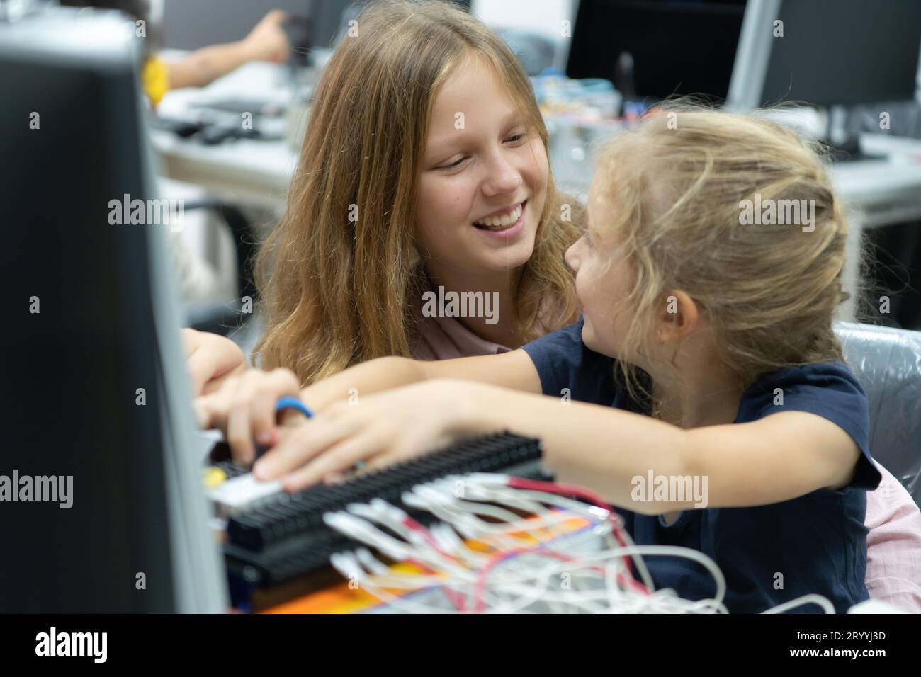 Children using the hand robot technology and having fun Learning the ...