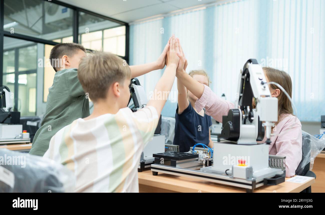 Children using the hand robot technology and having fun Learning ...