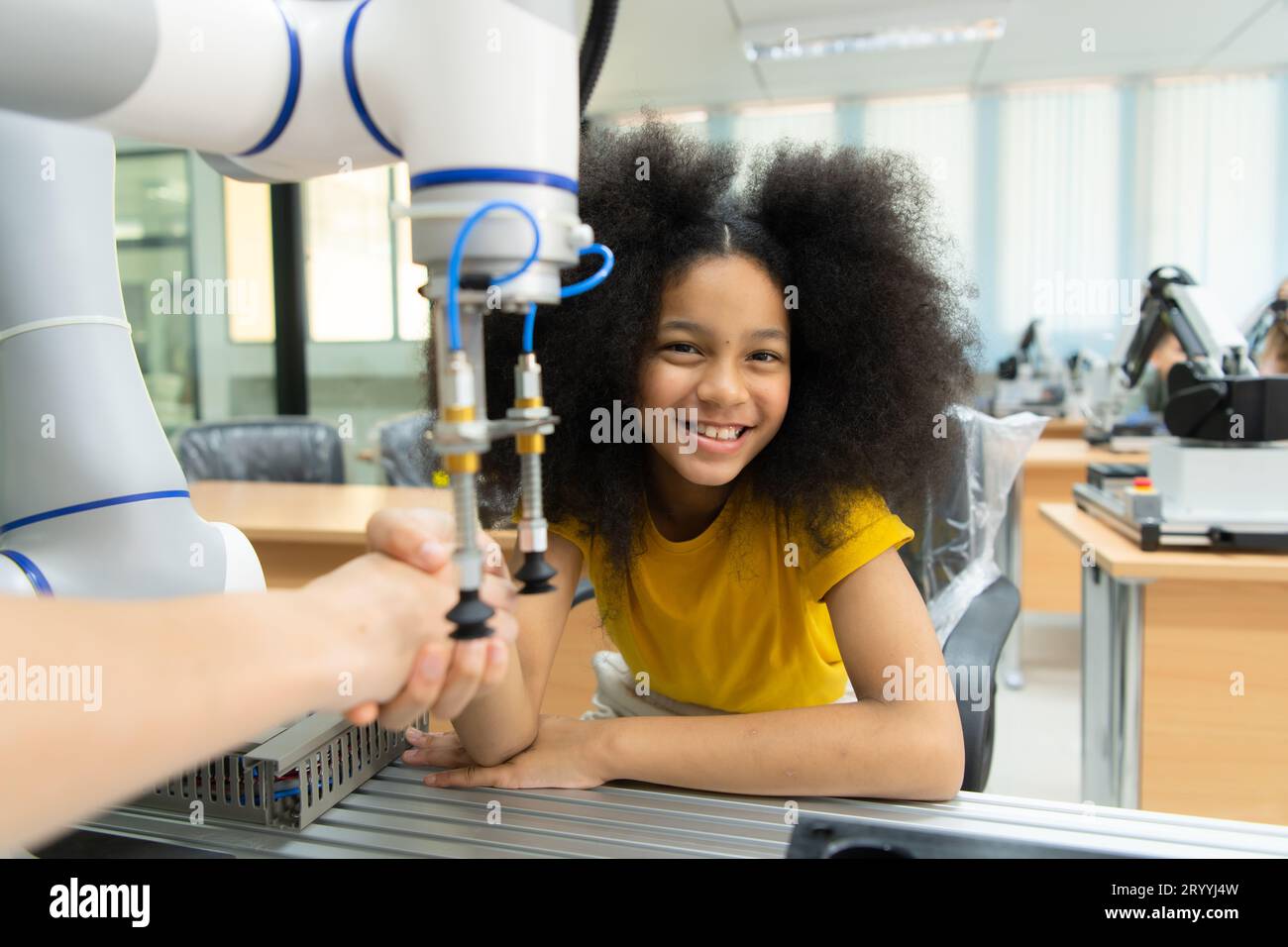Children using the hand robot technology, Students are studying ...
