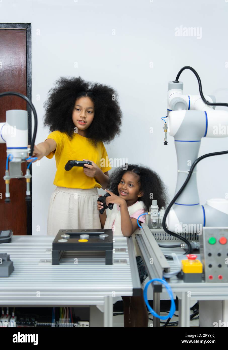 Children using the hand robot technology, Students are studying ...