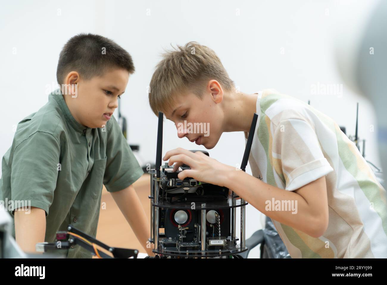 Children using the hand robot technology, Students are studying ...